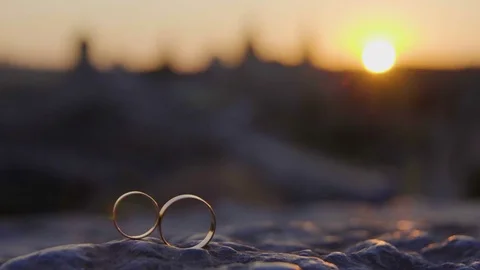 Wedding rings on sunset castle backgroun... | Stock Video | Pond5