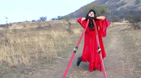 Weird Female Standing In The Field With ... | Stock Video | Pond5