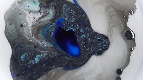 Weird oil experiment with blue and black... | Stock Video | Pond5