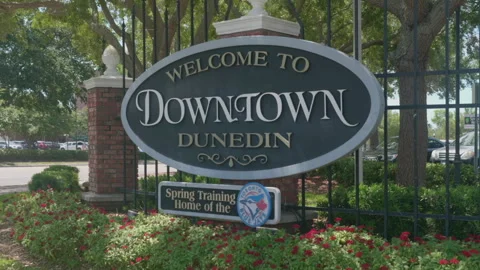 Welcome sign in Downtown Dunedin, Florid... | Stock Video | Pond5