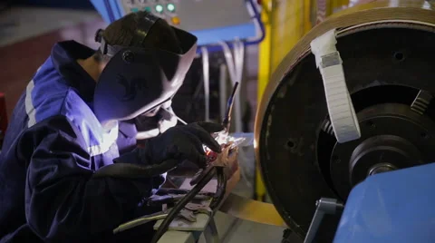 Welder welding metal at a electric engin... | Stock Video | Pond5