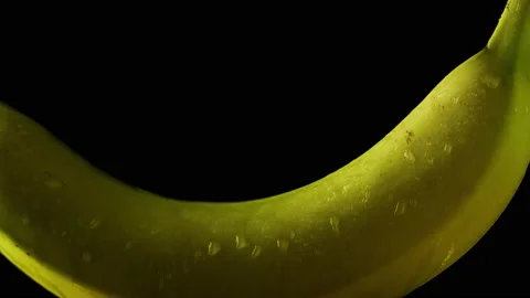 Wet banana rotates on isolated backgroun... | Stock Video | Pond5