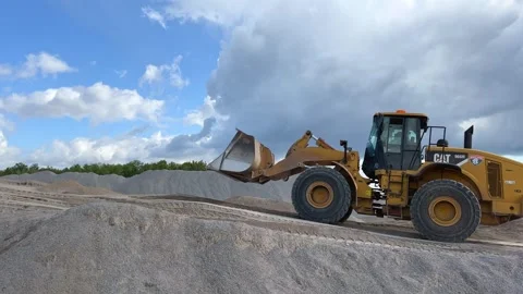 Wheel loader with a bucket in front, Sid... | Stock Video | Pond5