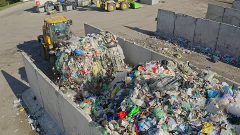 Wheel loader in landfill site handling w... | Stock Video | Pond5