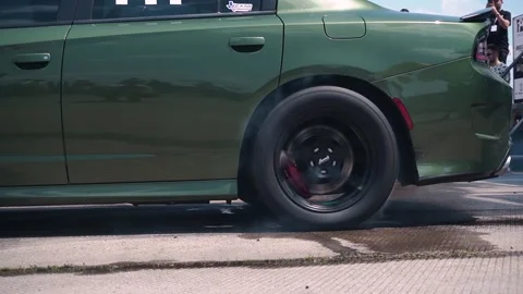 Wheel slip in place, in a sports car at ... | Stock Video | Pond5