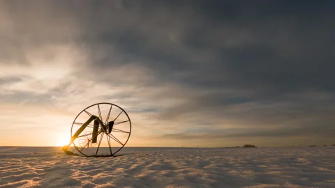 Wheel On Snow Under Dramatic Sky On A Sp... | Stock Video | Pond5