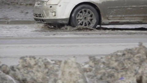 Wheels ran over the water splash Car dri... | Stock Video | Pond5