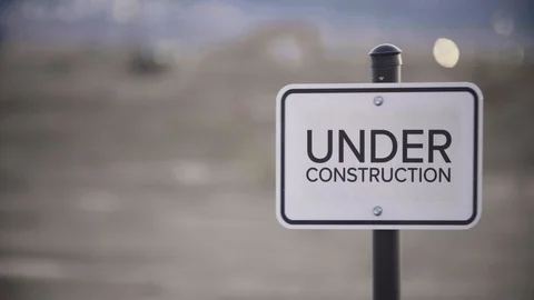 Whip pan shot of under construction sign... | Stock Video | Pond5