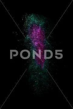 White and violet dust explosion isolated on black background Stock ...