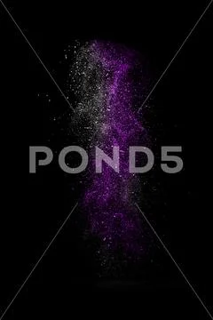 White and violet dust explosion isolated on black background ~ Premium ...