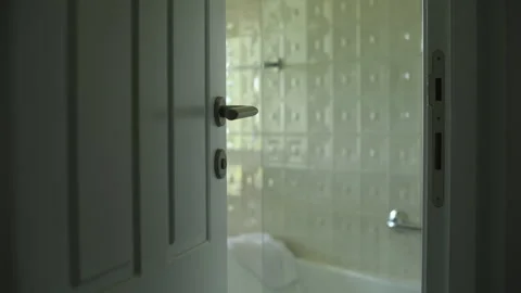 White bathroom door left ajar and closin... | Stock Video | Pond5