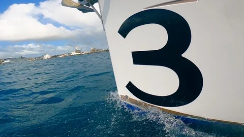 White boat with a number three on it flo... | Stock Video | Pond5