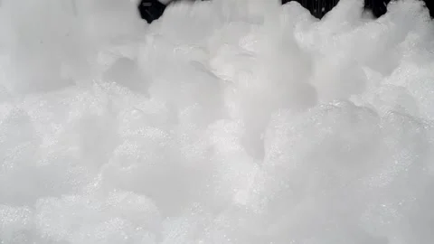 white bubble Foam waving in pool on whit... | Stock Video | Pond5
