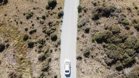 White Car is driving trough a road in Ne... | Stock Video | Pond5