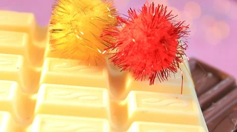 White Chocolate - yellow - red candy on ... | Stock Video | Pond5