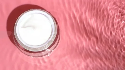 White facial cream on pink background wi... | Stock Video | Pond5