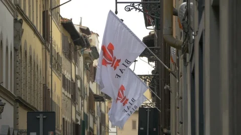 White flags waving on a building facade | Stock Video | Pond5