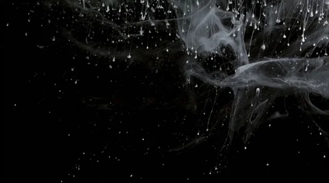 White ink and particles floating in spac... | Stock Video | Pond5