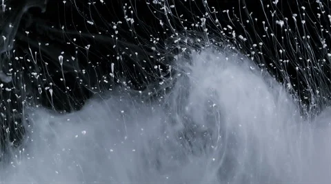 White ink particles floating trough spac... | Stock Video | Pond5