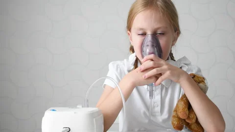 white little girl makes inhalation with ... | Stock Video | Pond5