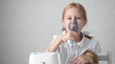 white little girl makes inhalation with ... | Stock Video | Pond5