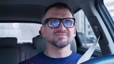 White man with beard driving car,smiling... | Stock Video | Pond5