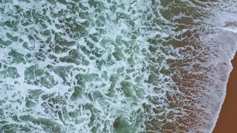 White ocean foam waving at sandy beach c... | Stock Video | Pond5