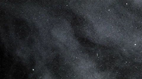 White particles and ink slowly moving on... | Stock Video | Pond5