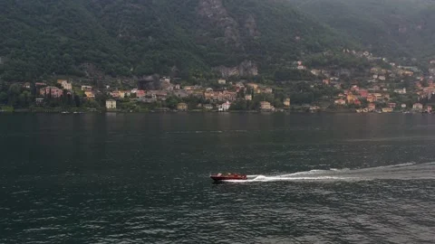 White Speed Boat On Lake Como Against Ba... | Stock Video | Pond5