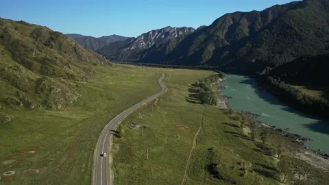 White SUV mini van riding on asphalt roa... | Stock Video | Pond5