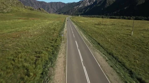 White SUV van riding on asphalt road sur... | Stock Video | Pond5