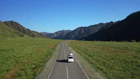 White SUV van riding on traffic asphalt ... | Stock Video | Pond5