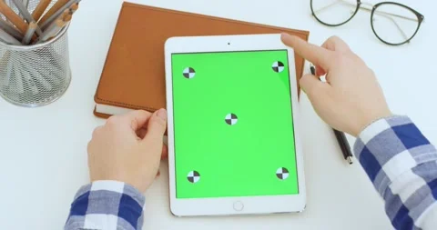 White tablet device with green screen in... | Stock Video | Pond5