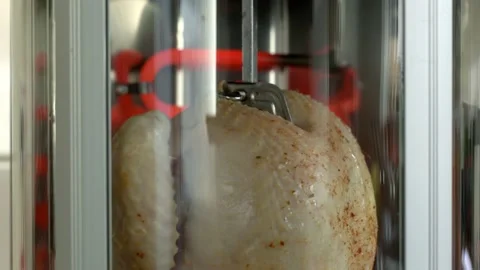 Whole chicken roasting rotating inside e... | Stock Video | Pond5