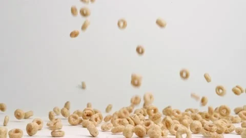 Whole grain cheerio cereal bouncing into... | Stock Video | Pond5