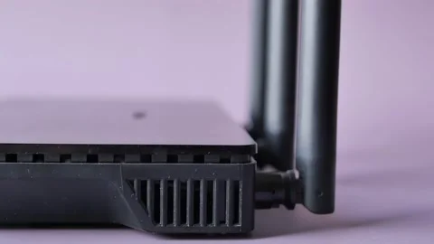 Wi-Fi router with cables on table | Stock Video | Pond5