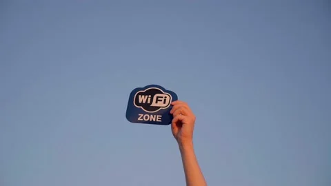 Wi-Fi Zone sign sticker in man's hand on... | Stock Video | Pond5