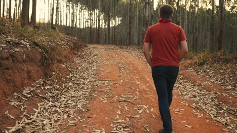 Wide angle tracking shot of young man wa... | Stock Video | Pond5