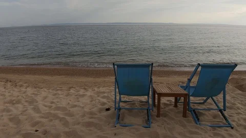 Wide back view of a beach blue chairs. C... | Stock Video | Pond5