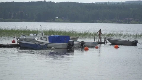 Wide, kids jumping off a floating dock i... | Stock Video | Pond5