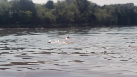 Wide of a man floating on his back in a ... | Stock Video | Pond5