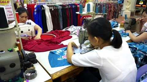 wide shot of girls using sewing machines... | Stock Video | Pond5