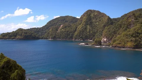 A wide shot of a tropical island bay wit... | Stock Video | Pond5