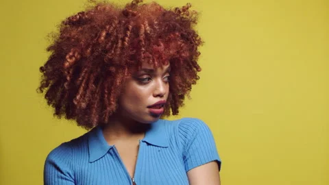 Wide shot of a woman in blue jeans blowi... | Stock Video | Pond5