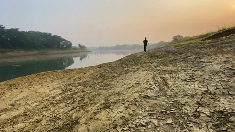 Wide static shot of runner jogging towar... | Stock Video | Pond5