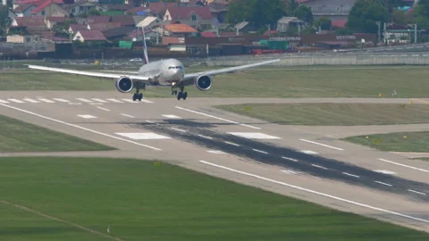 Widebody airplane landing, front view | Stock Video | Pond5