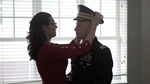 Wife putting formal uniform hat on soldi... | Stock Video | Pond5