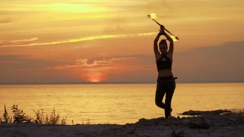 Wild looking woman makes fires show on s... | Stock Video | Pond5