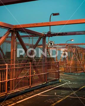 The Williamsburg Bridge pedestrian walkway at night, in New York City ...
