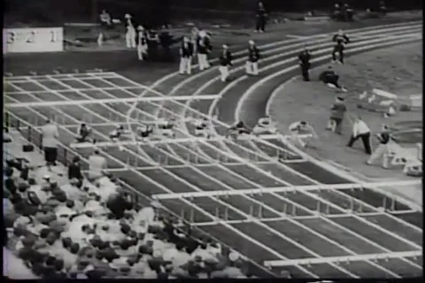 Wilt chamberlain wins high jump event at... | Stock Video | Pond5